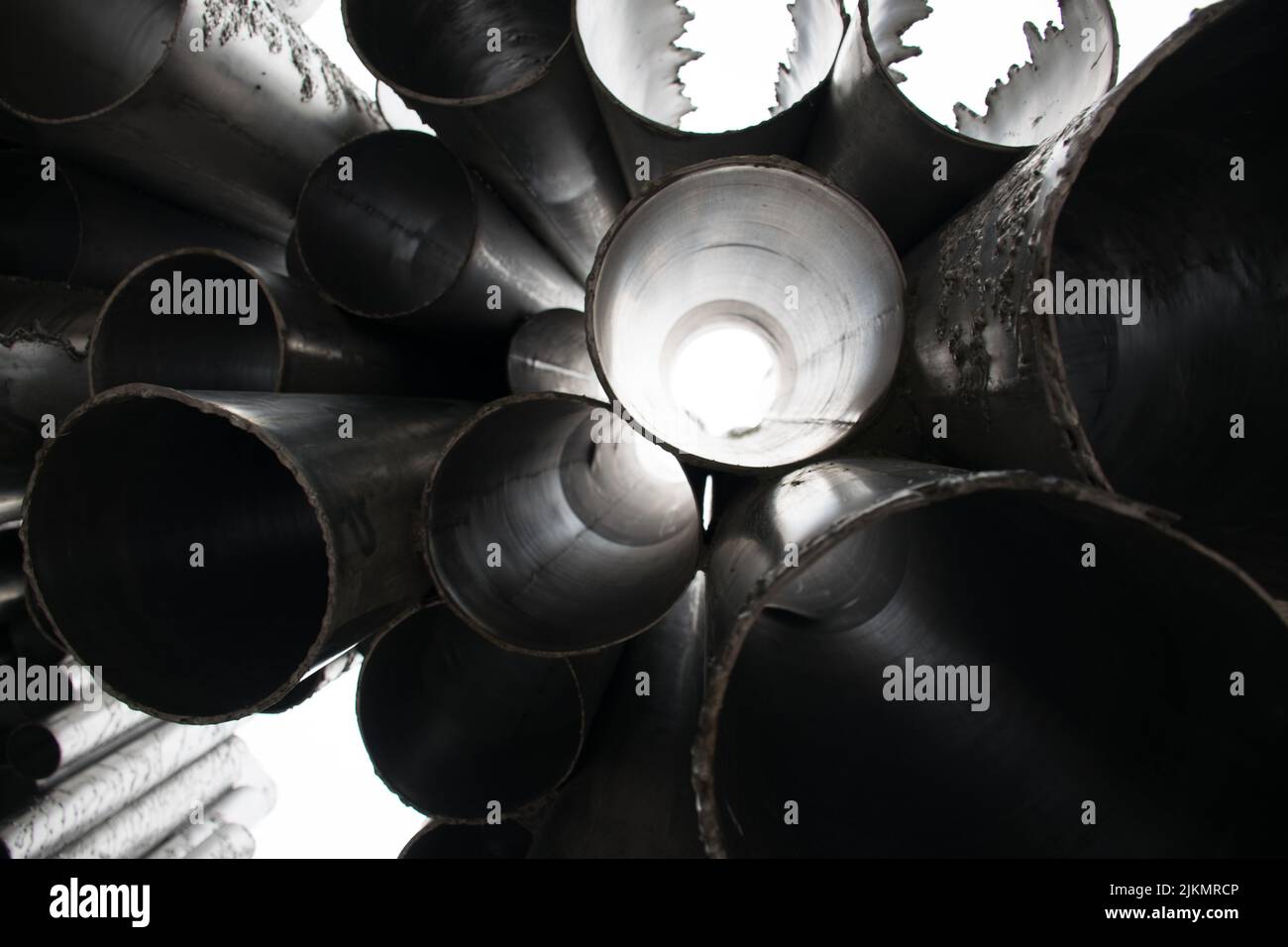 A low angle shot of metal pipes in black and white Stock Photo - Alamy