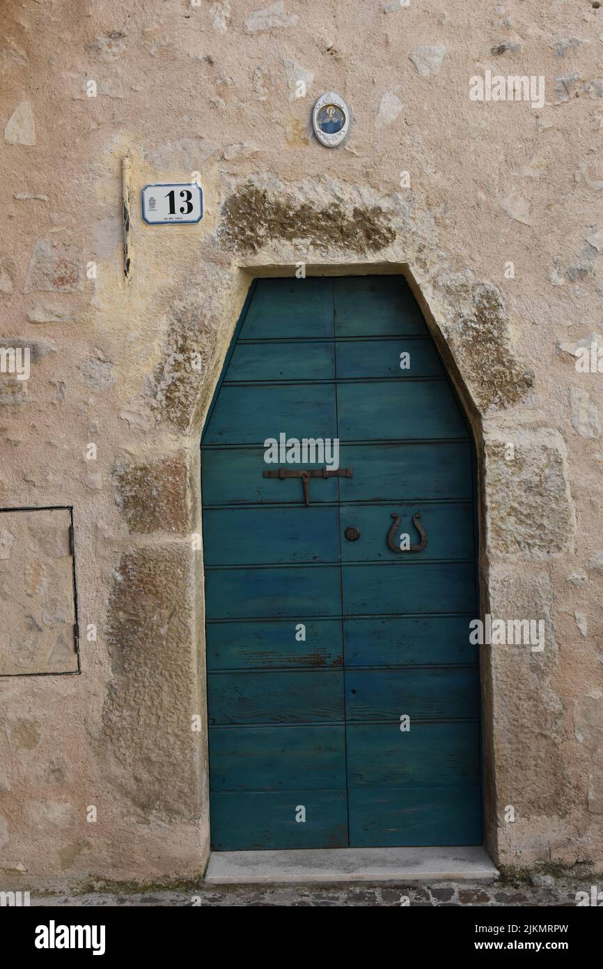 The blue entrance door of an old house in Castrovalva, a town in ...