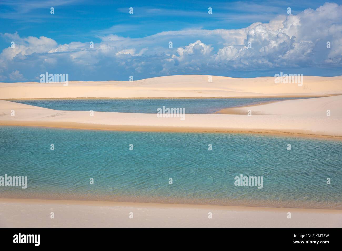 Amazing blue fresh water lagoon with sand dunes in northern of Brazil ...