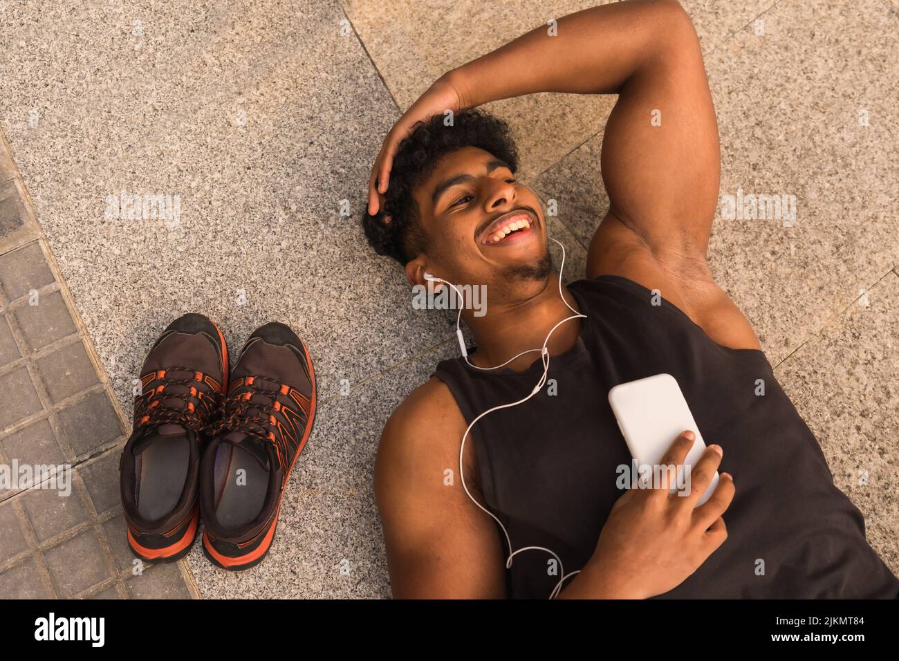 Young man lying on concrete hi-res stock photography and images - Alamy