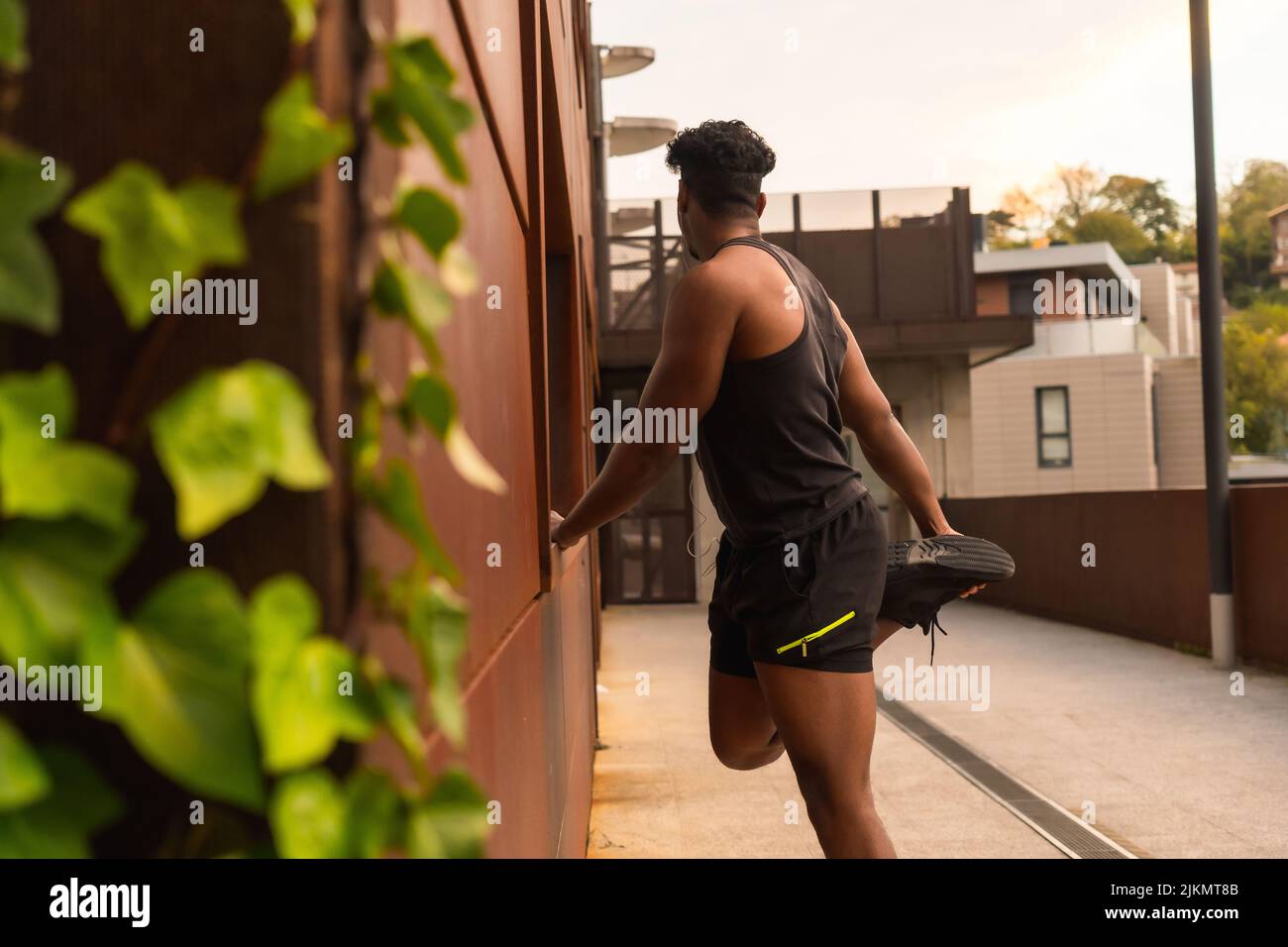Arab strong young man doing stretching exercises before sport in the ...