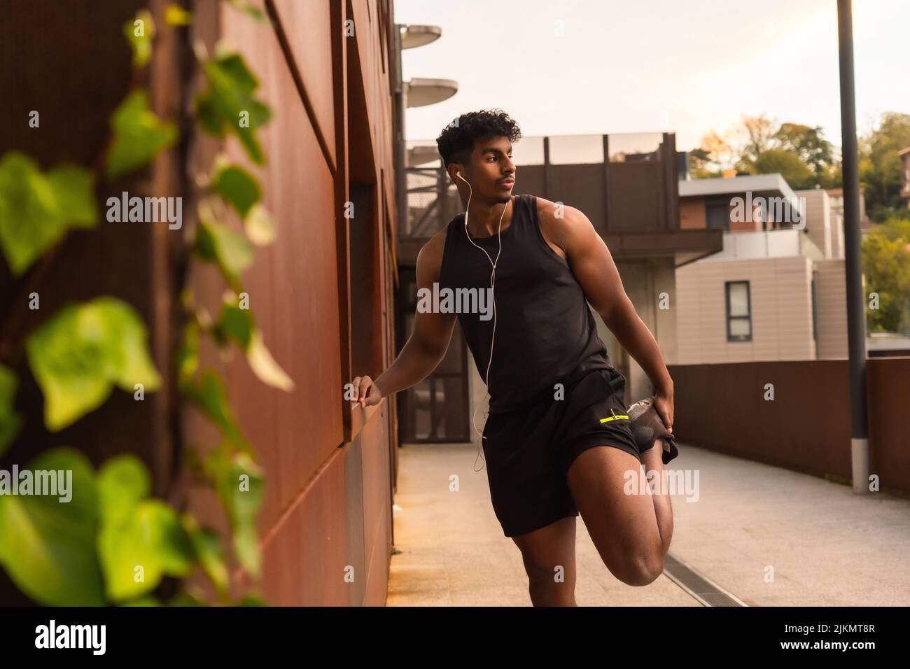 Arab strong young man doing stretching exercises before sport in the ...