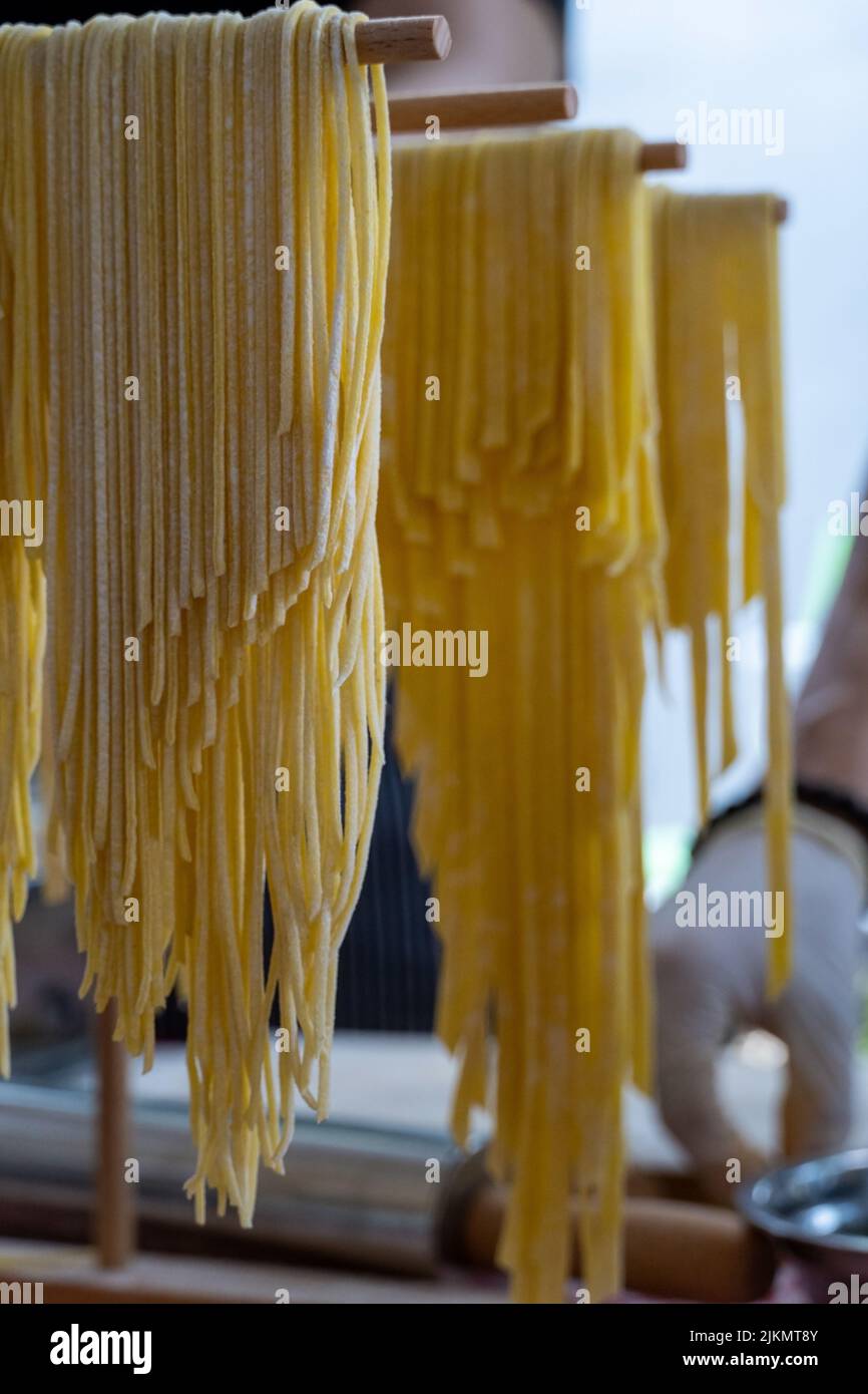 Fettuccine drying on a rack hi-res stock photography and images - Alamy