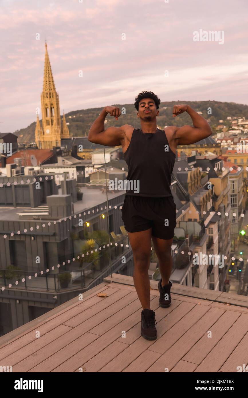 Arab young man doing sports in the city, showing off the great muscle ...