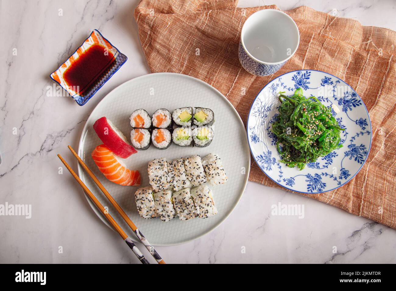 Set of sushi, maki and wakame on a marble table. Top view with copy ...