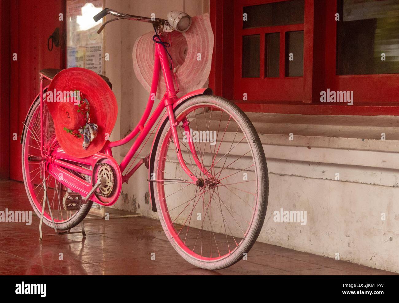 A pink bicycle with hats in Kota Tua, Jakarta, Indonesia Stock Photo ...