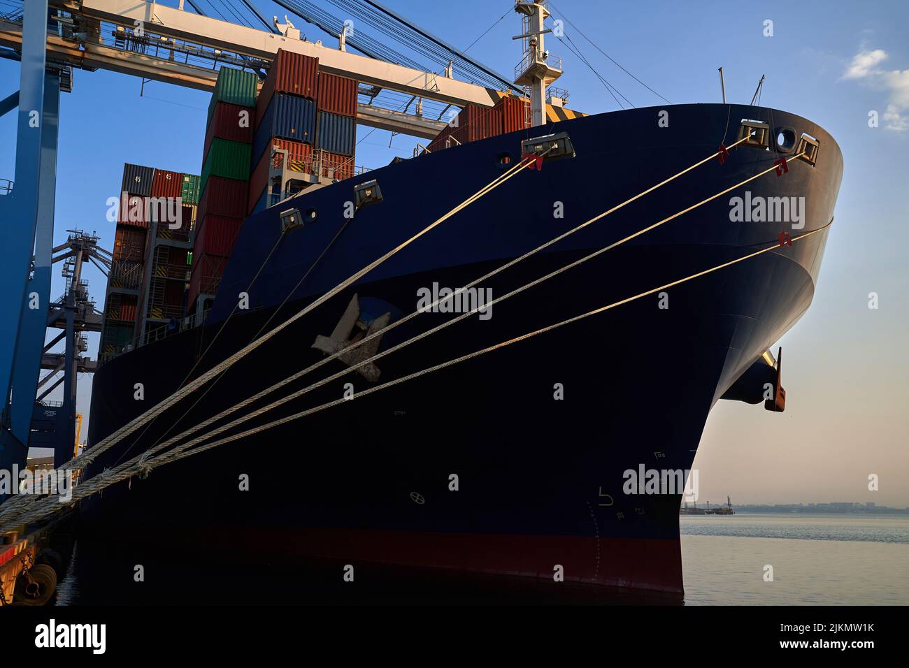 Container ship in port at container terminal. Ships of container ships ...