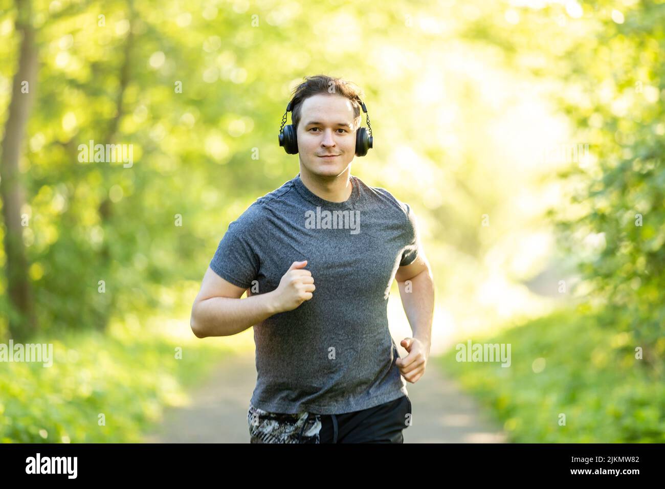 Man runs in forest hi-res stock photography and images - Alamy