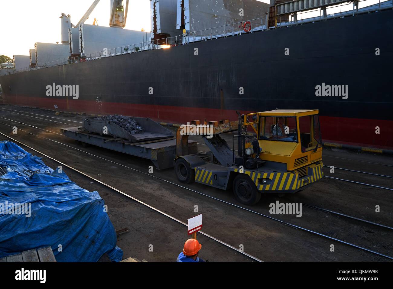 Loading cast iron ingots on ship bulk. Loading metal on ship ...