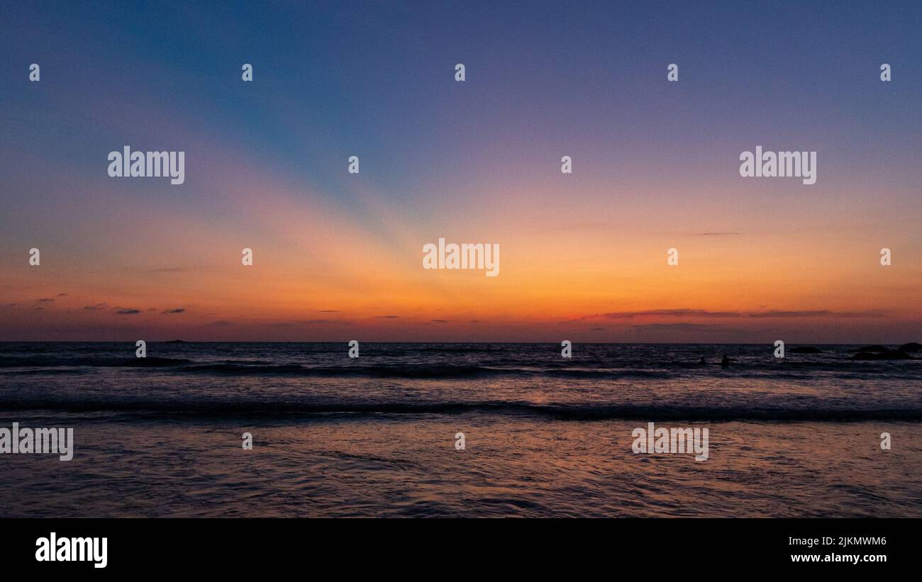 A scenic view of the sunset over the Kudle Beach in Gokarna, India ...