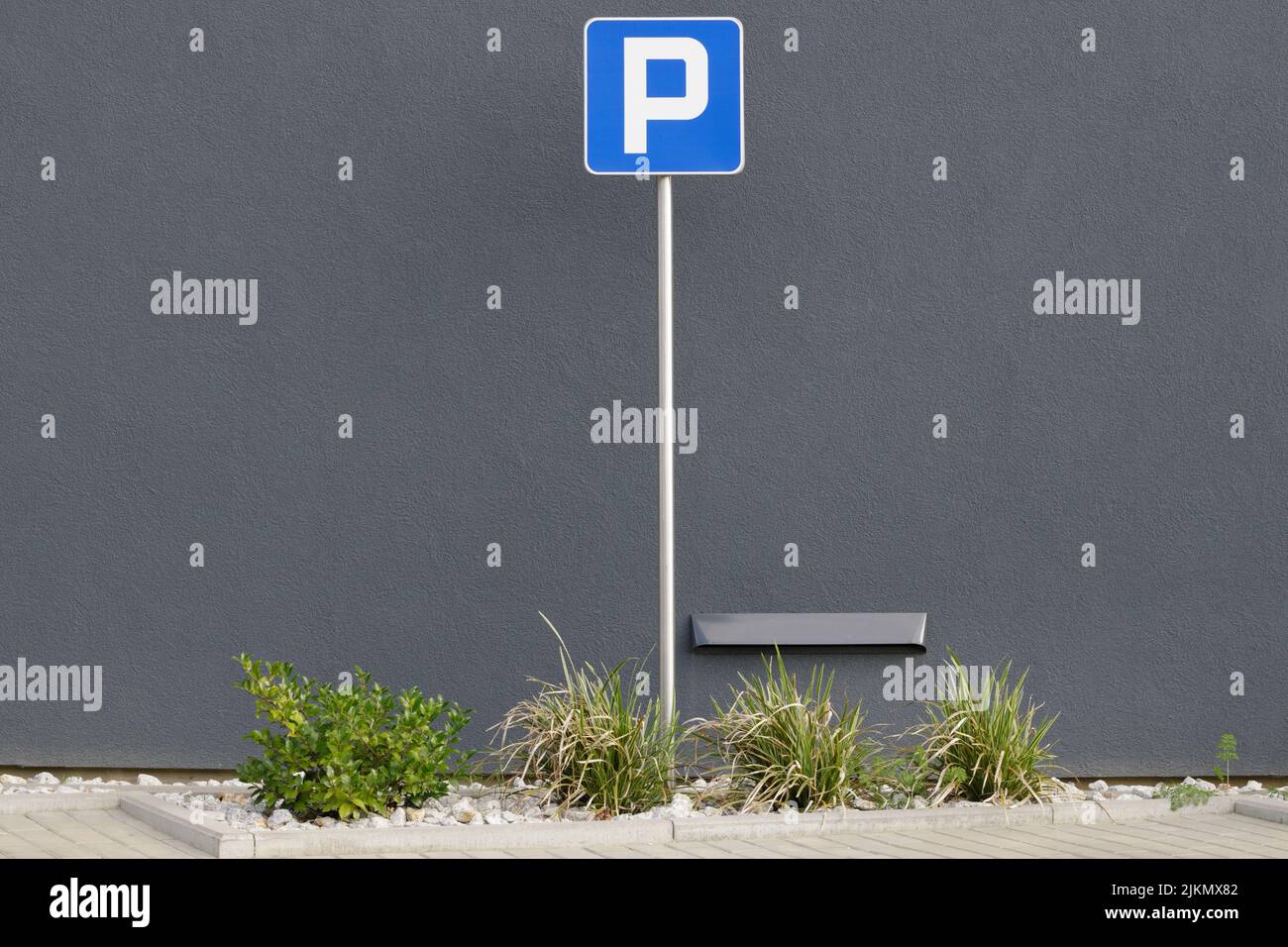 Parking space sign, in front of the building Stock Photo - Alamy