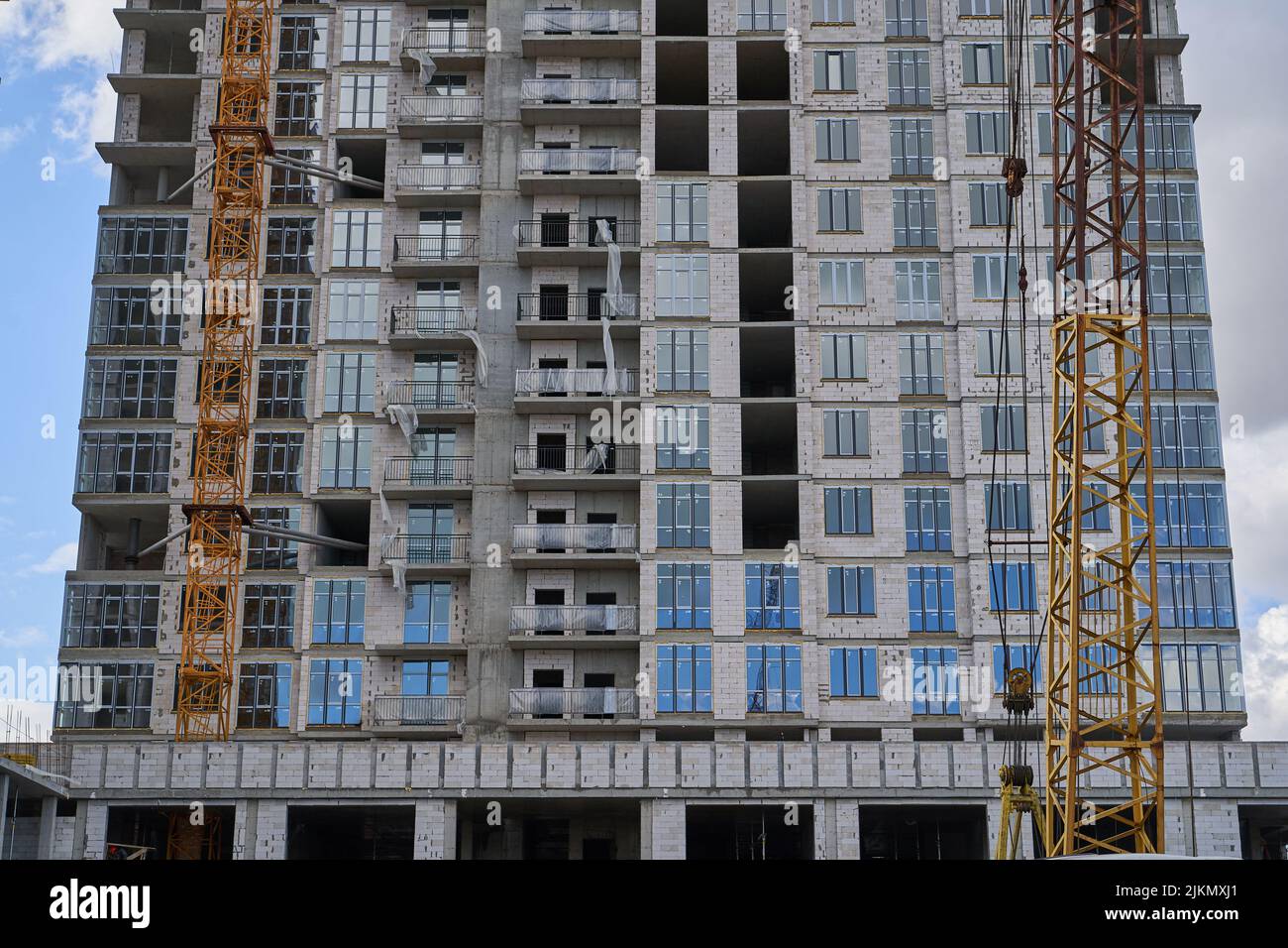 Construction site. High rise Building under construction. Construction ...