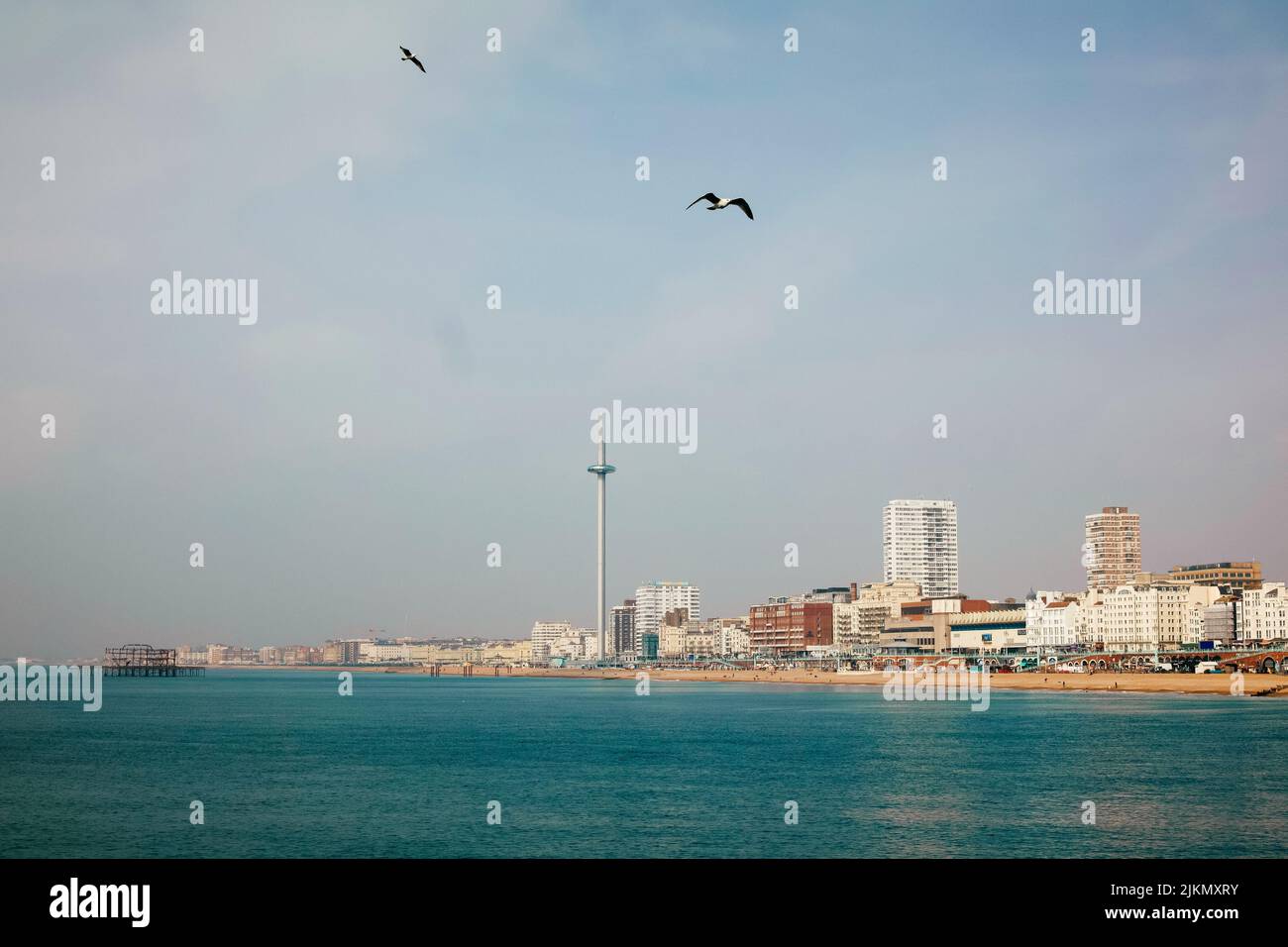 A scenic view of a Brighton seafront against the buildings Stock Photo ...