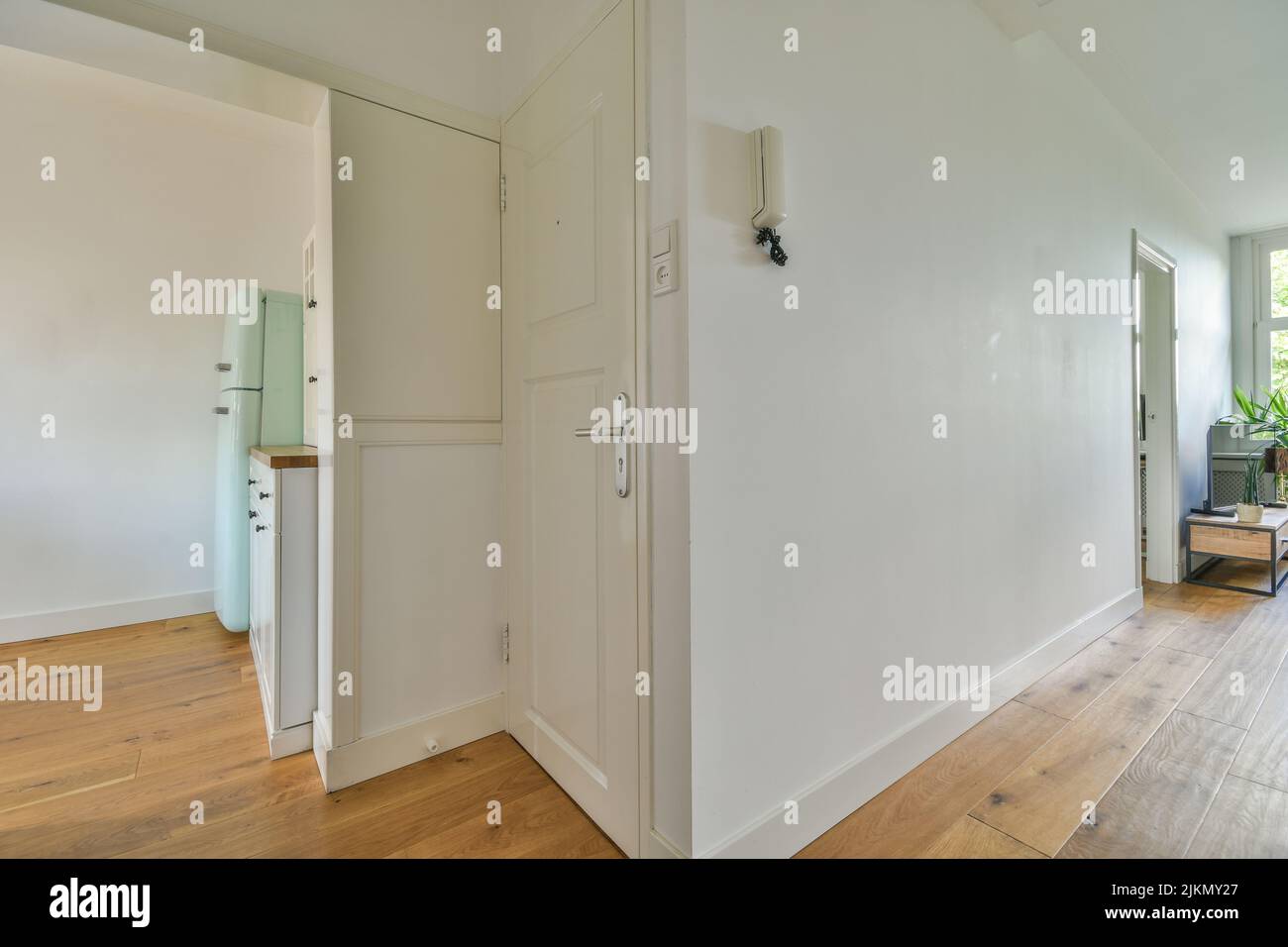 Room with door to balcony and narrow long corridor in perspective in ...