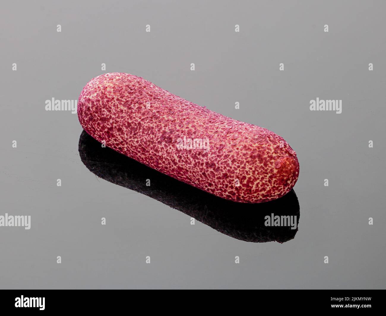 Sticky purple rice roll on a gray background Stock Photo - Alamy