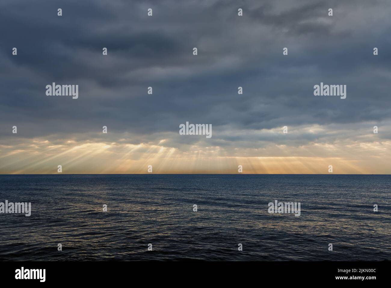 Cloudy sunset sky over sea hi-res stock photography and images - Alamy