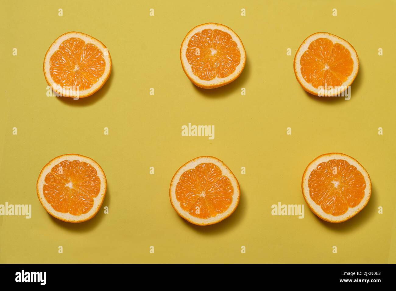 Orange top view with halves ripe orange on yellow background Stock ...