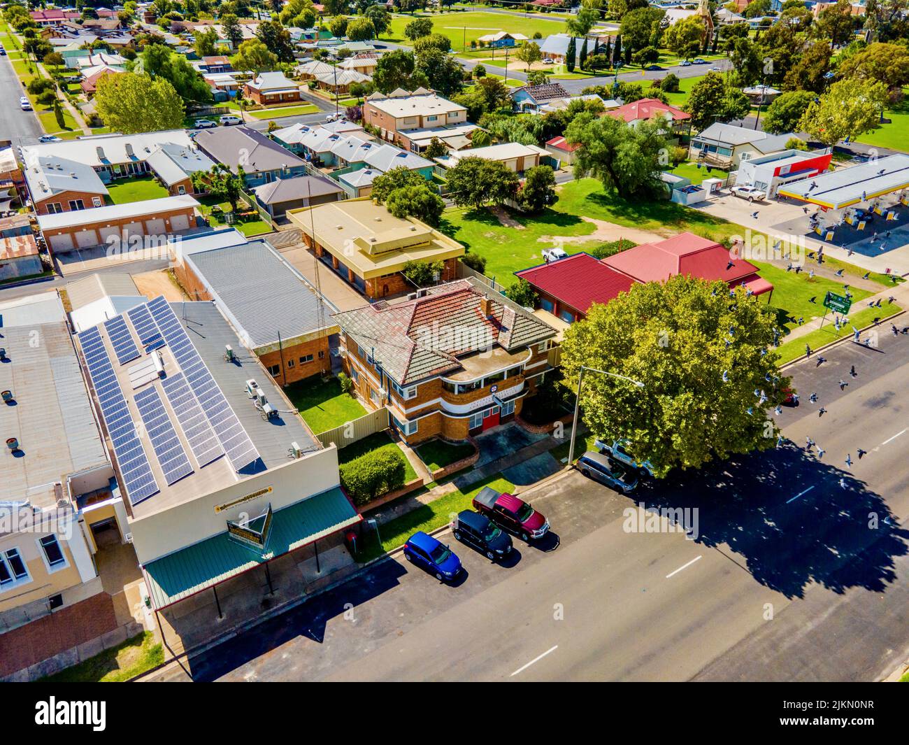 An aerial shot of buildings on the streets in Inverell, Australia with ...
