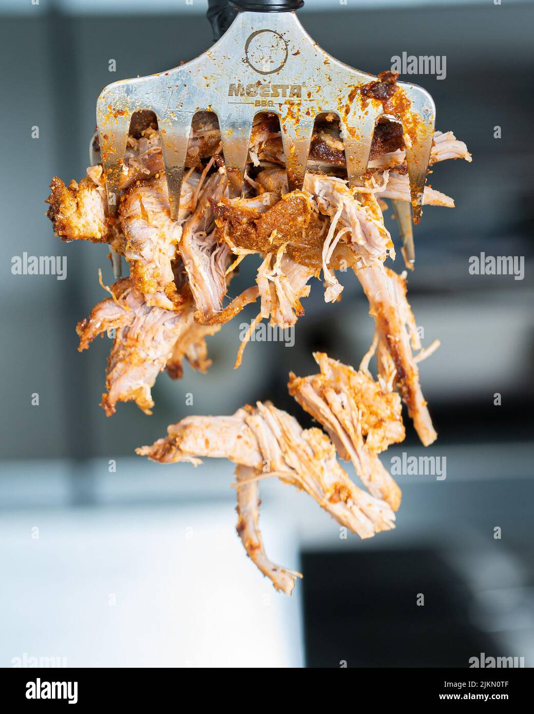 A vertical closeup of the fork with shredded meat Stock Photo - Alamy