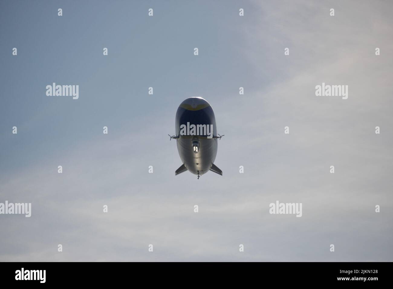 A colorful blimp or an airship high in the sky Stock Photo - Alamy