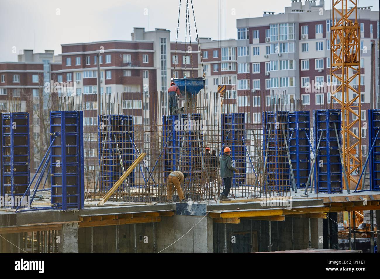 Pouring concrete on the construction of a high-rise building Stock Photo - Alamy
