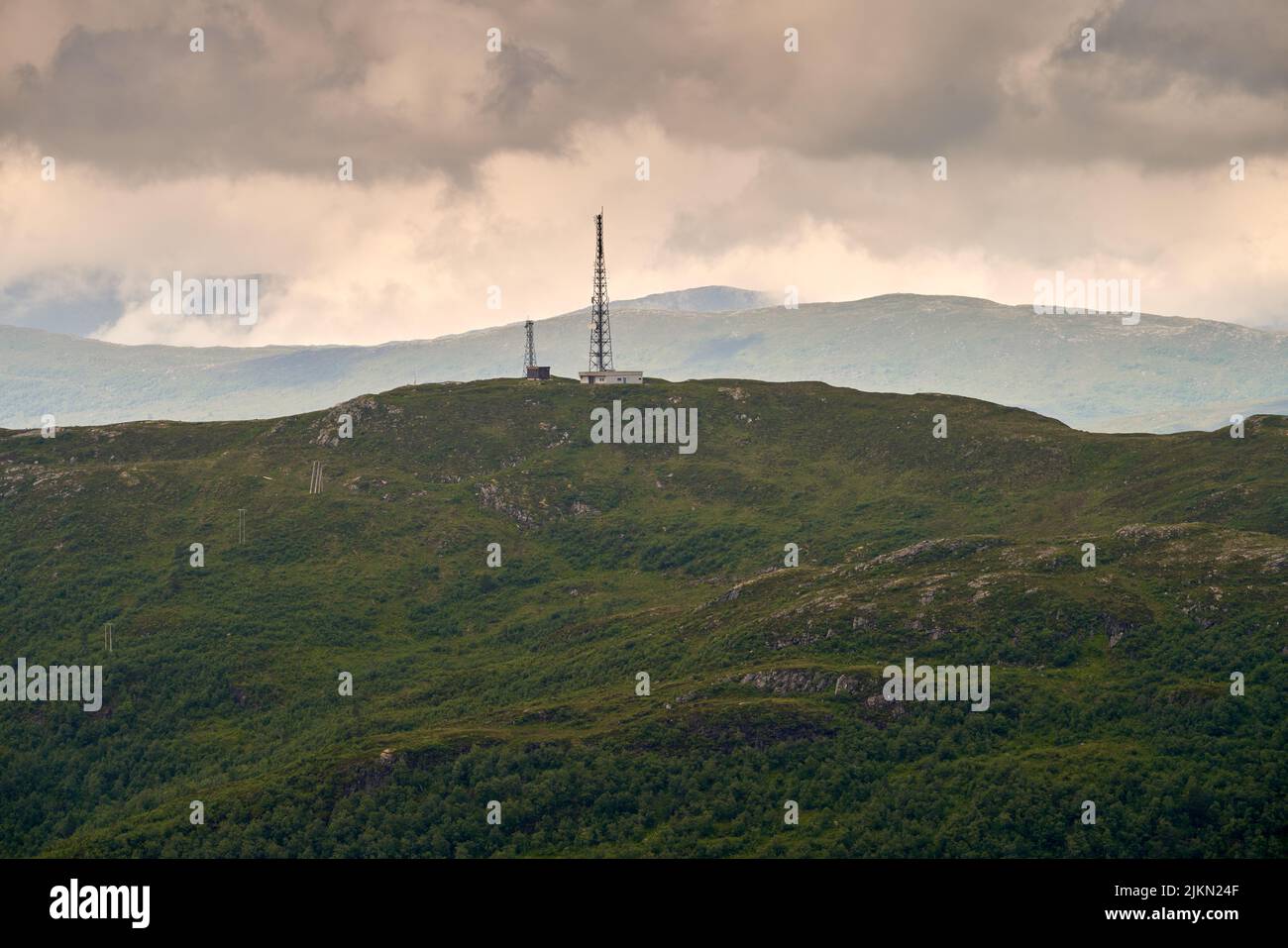 A view of the mobile communication tower and the mountains on a cloudy ...