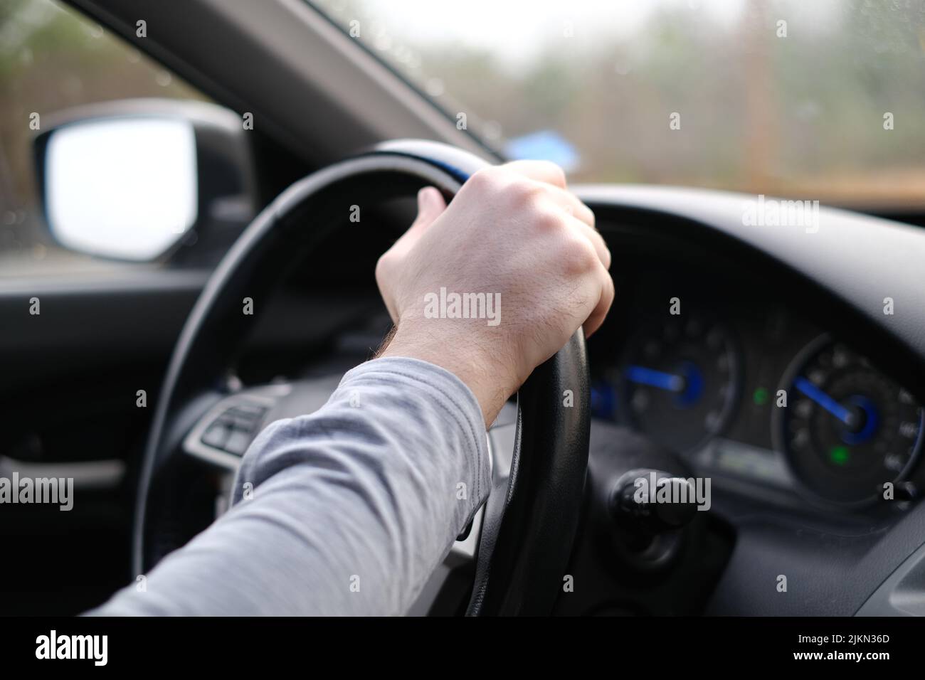 Black hand on steering wheel hi-res stock photography and images - Alamy