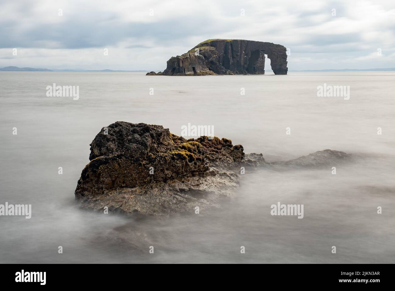 A long exposure shot of the Dore Holm rock formation in Shetland ...