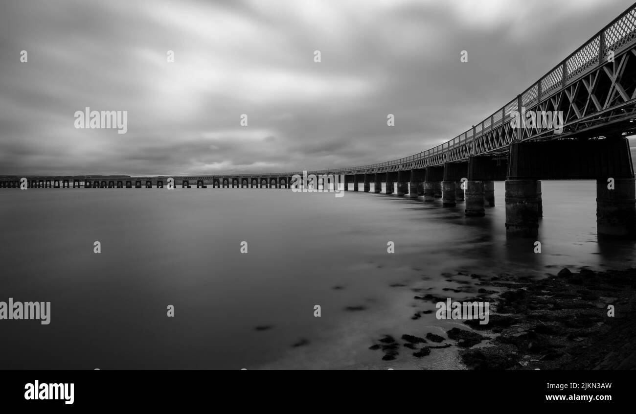 A grayscale shot of the Tay Rail bridge in Dundee, Scotland Stock Photo ...