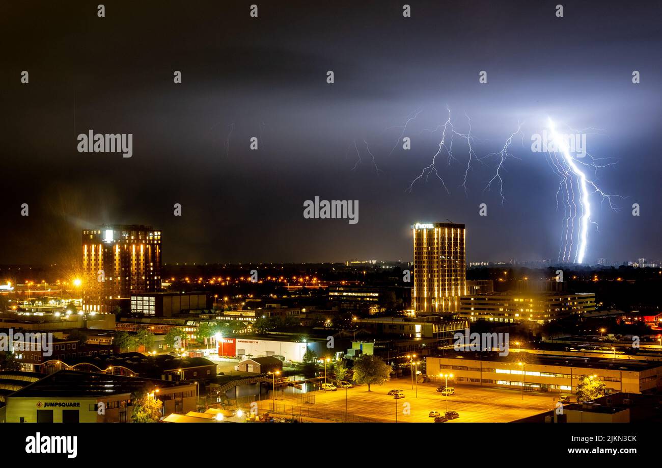 A beautiful night view of lightning over the city Stock Photo - Alamy