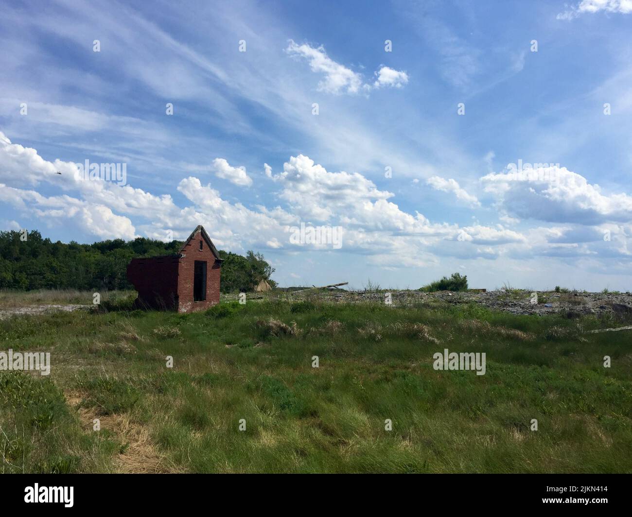 A panoramic view of field with blue cloud and green grass Stock Photo ...