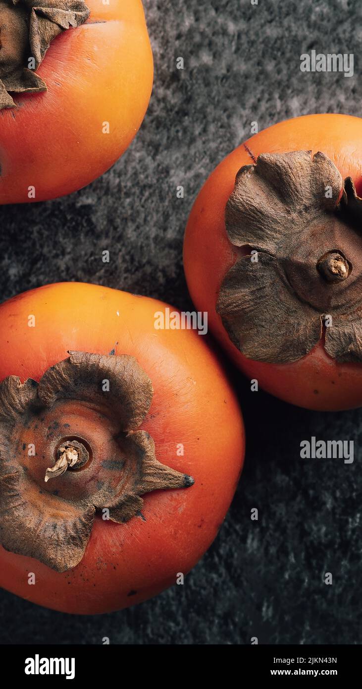Organic persimmons hi-res stock photography and images - Alamy