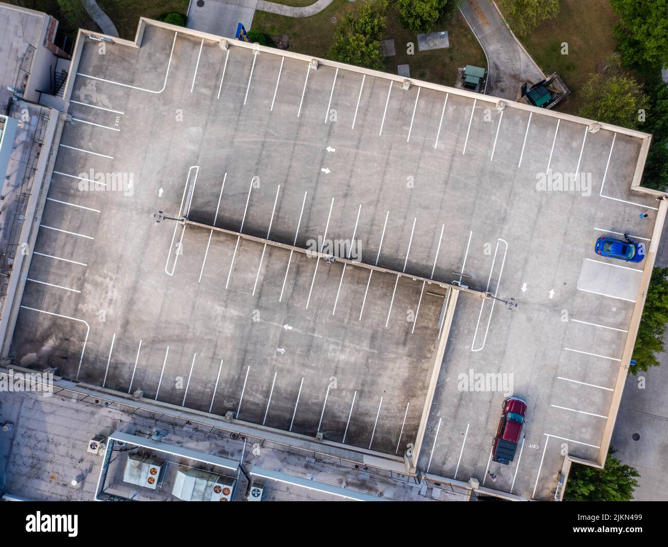 An aerial top shot of a parking garage with two cars Stock Photo - Alamy