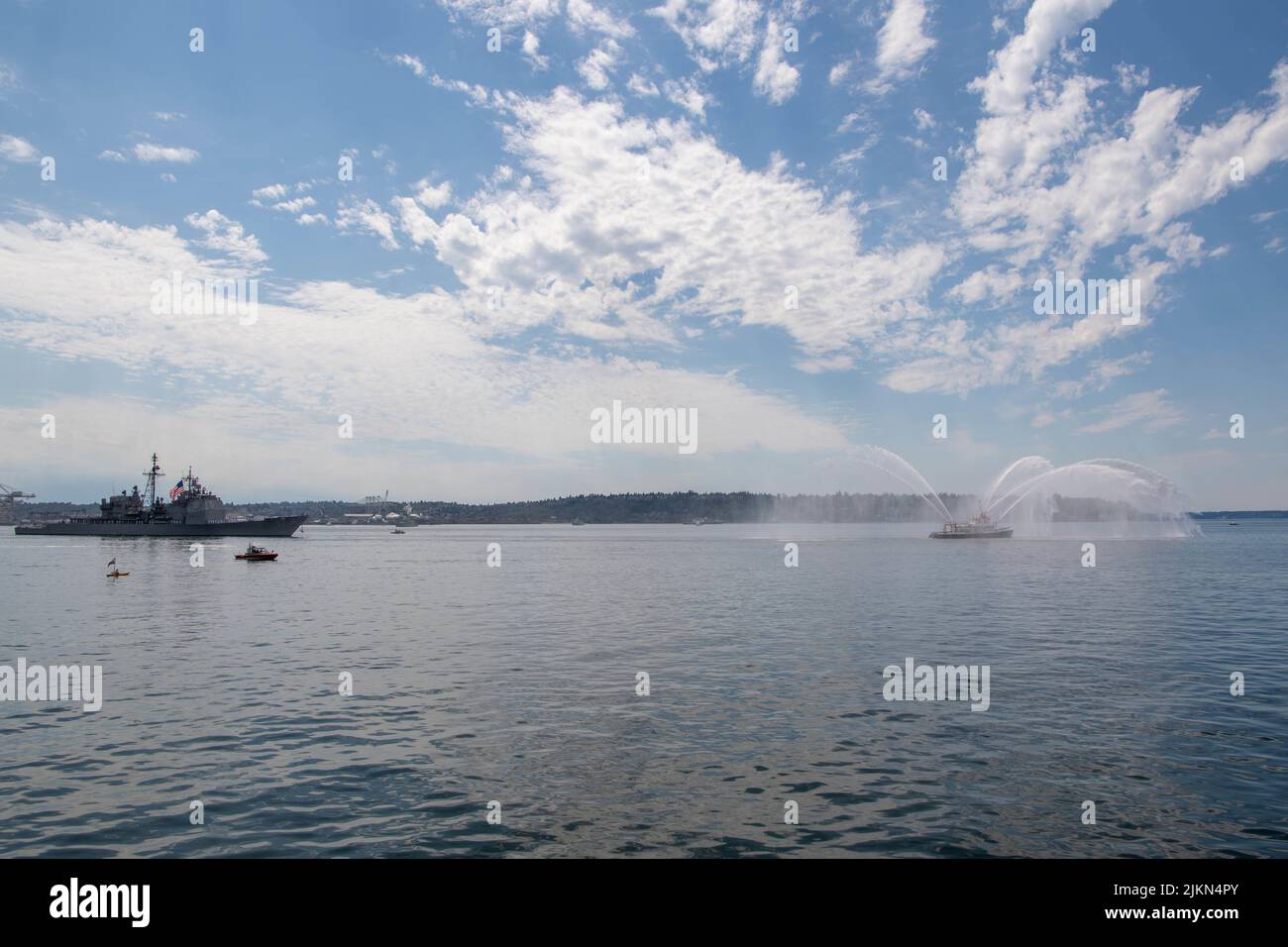 Seattle Fire Department Fireboat Leschi sprays water as the Ticonderoga ...