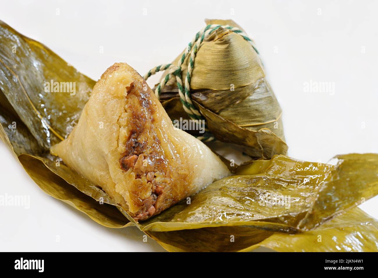 A steamed Chinese sticky rice dumpling, zongzi or bakcang, ready to eat ...