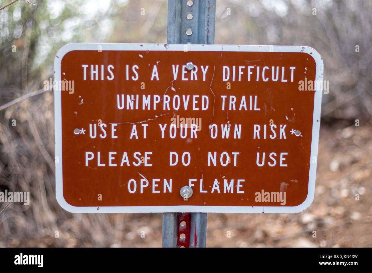 A SIgn warning about an unimproved trail, Wild Life Area Caution ...