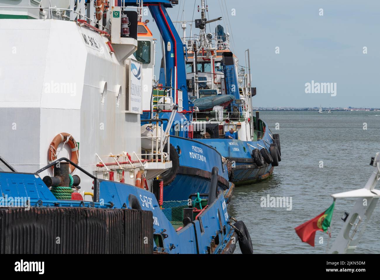 The huge tugs in the dock, boats designed to push, pull and tow barges ...