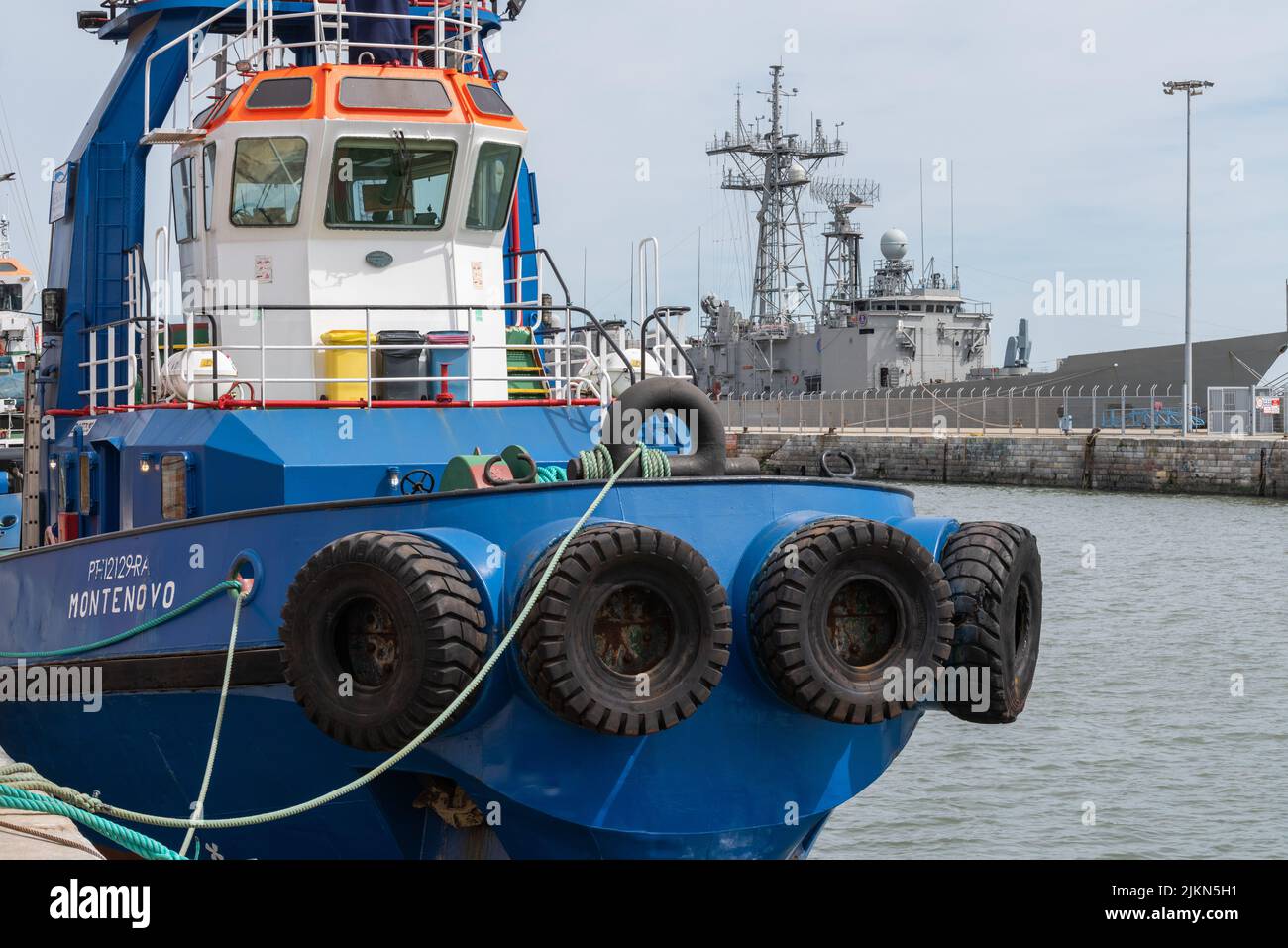 A big blue Tugboat in the sea designed to push, pull and tow barges or ...
