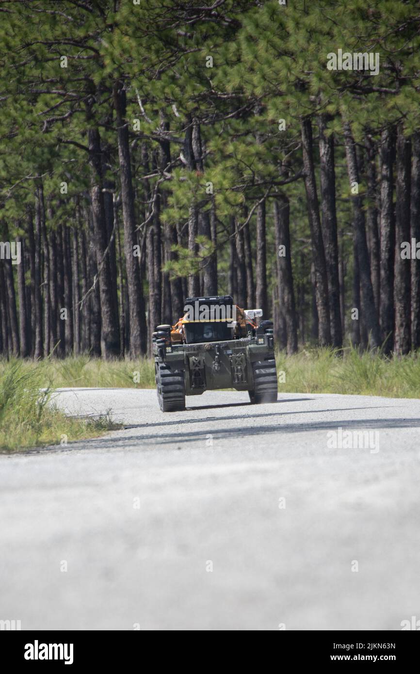 An Expeditionary Modular Autonomous Vehicle (EMAV) delivers supplies ...