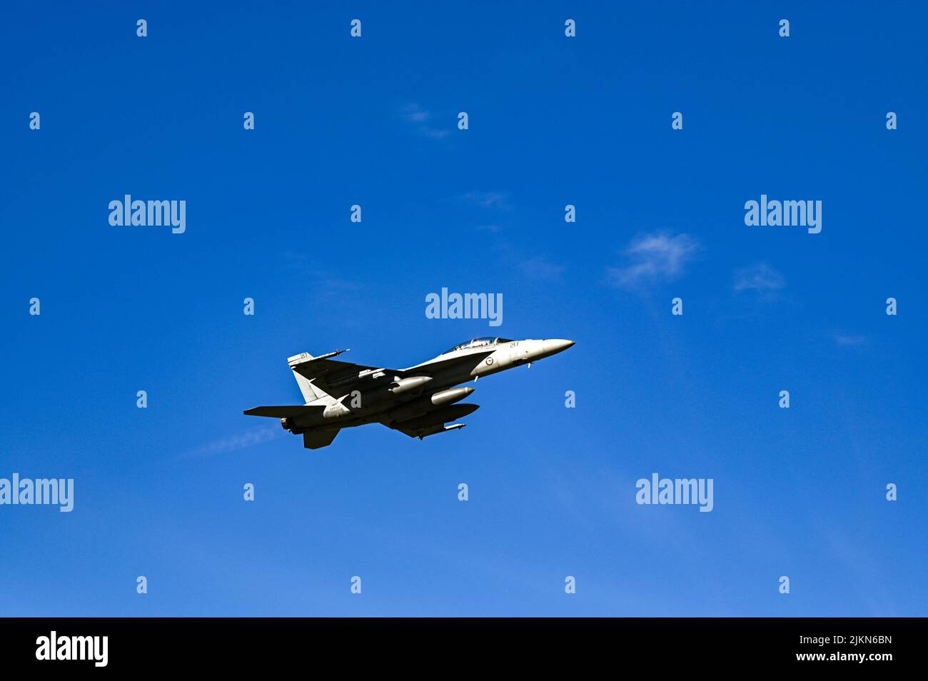 A Royal Australian Air Force F-18 Super Hornet soars through the sky ...