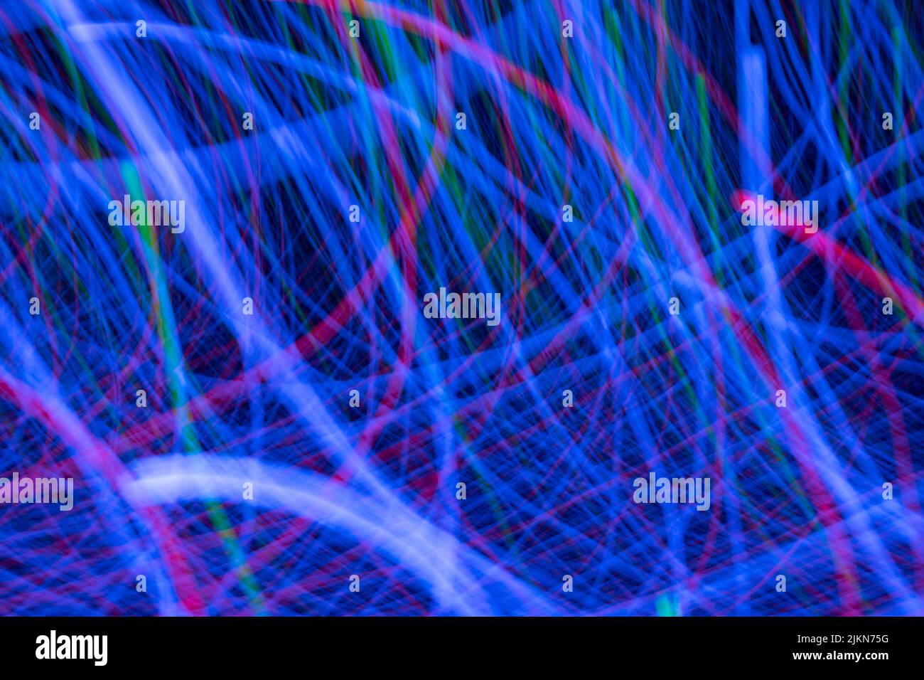 An abstract colored light lines on a black background, light art Stock ...