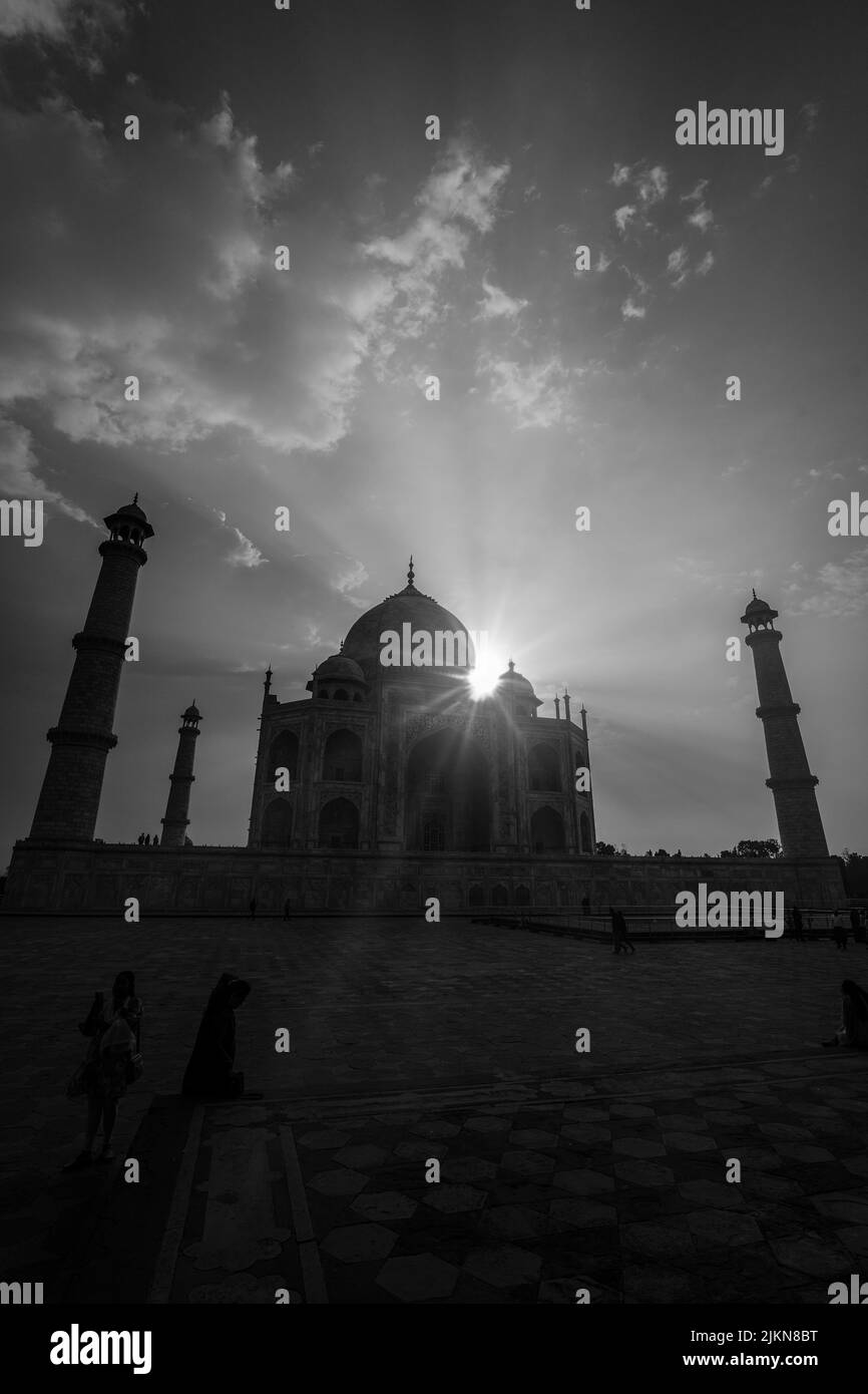 A low angle of a scenic view of the Taj Mahal Mausoleum in grayscale ...