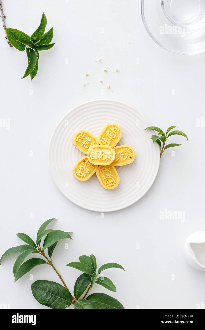 A vertical shot of aesthetic table setup with traditional Chinese ...