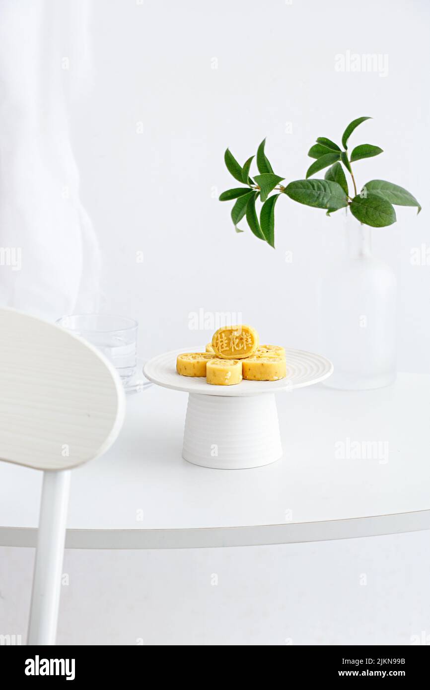 A vertical shot of aesthetic table setup with traditional Chinese ...