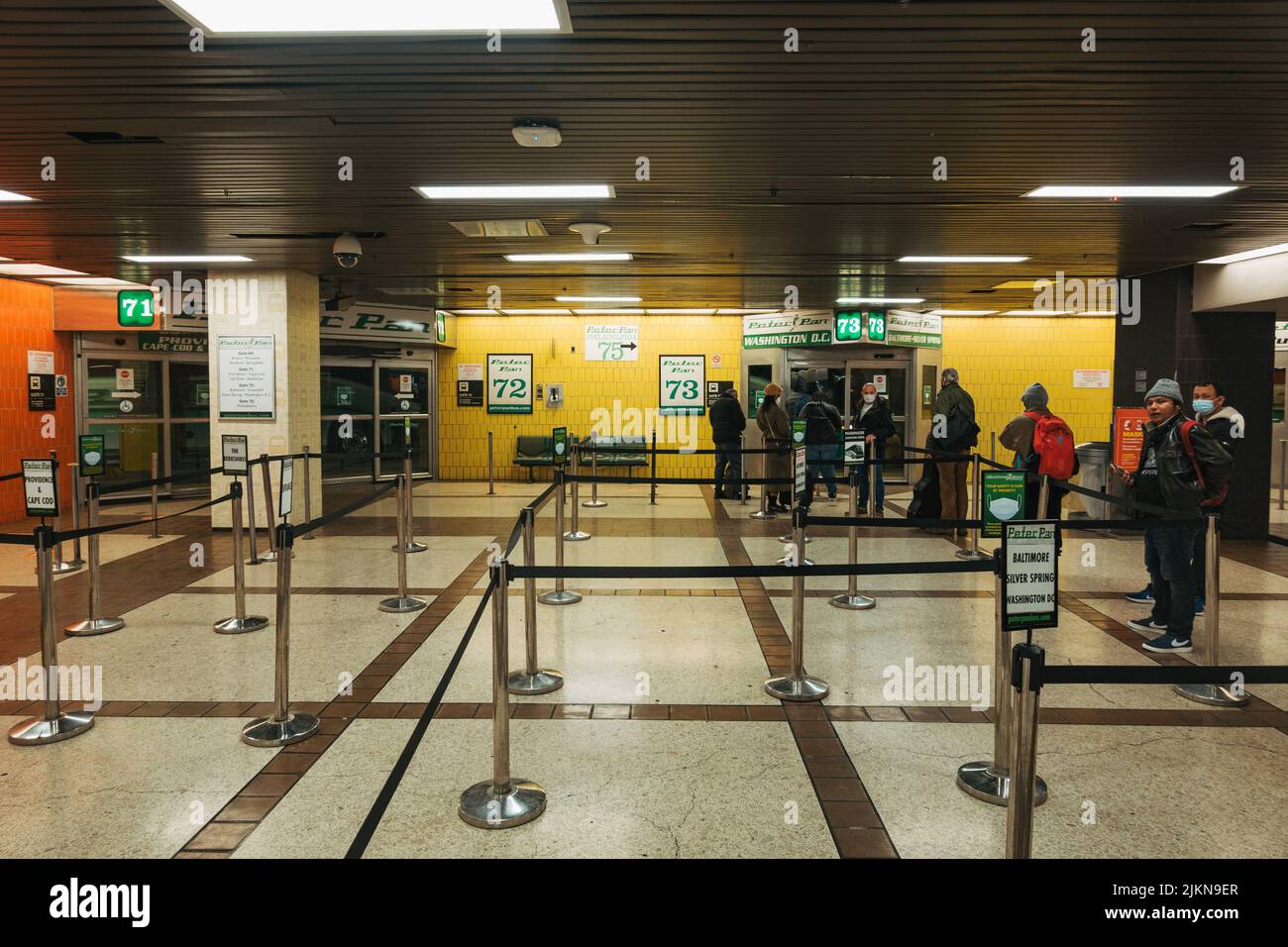Passengers queueing up to board intercity Peter Pan buses at Penn ...