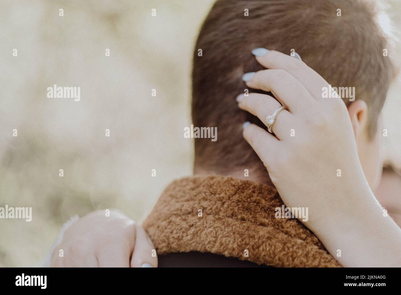 A close-up of woman's hands hugging her husband Stock Photo - Alamy