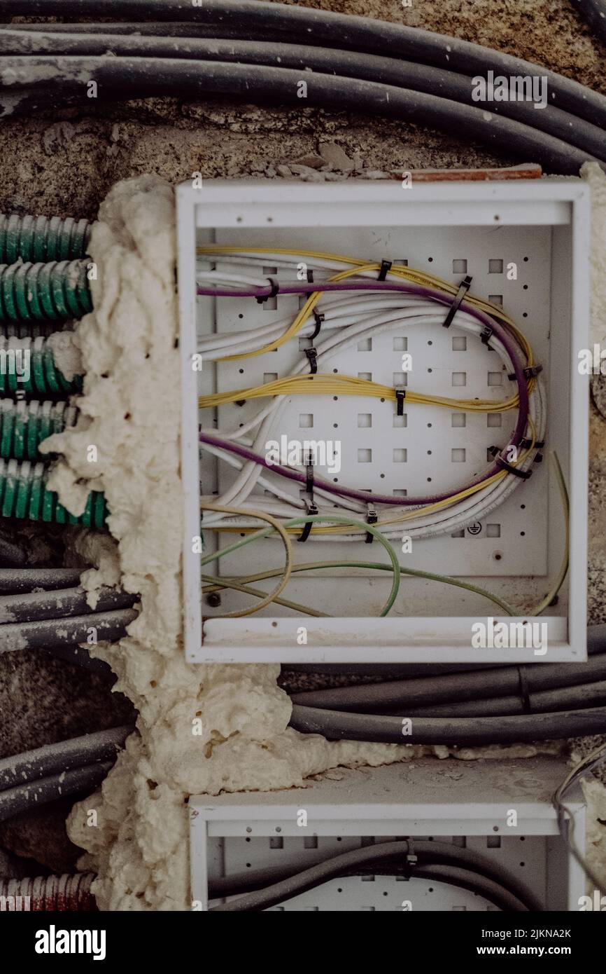 A vertical shot of an electrical switchboard on a wall Stock Photo - Alamy