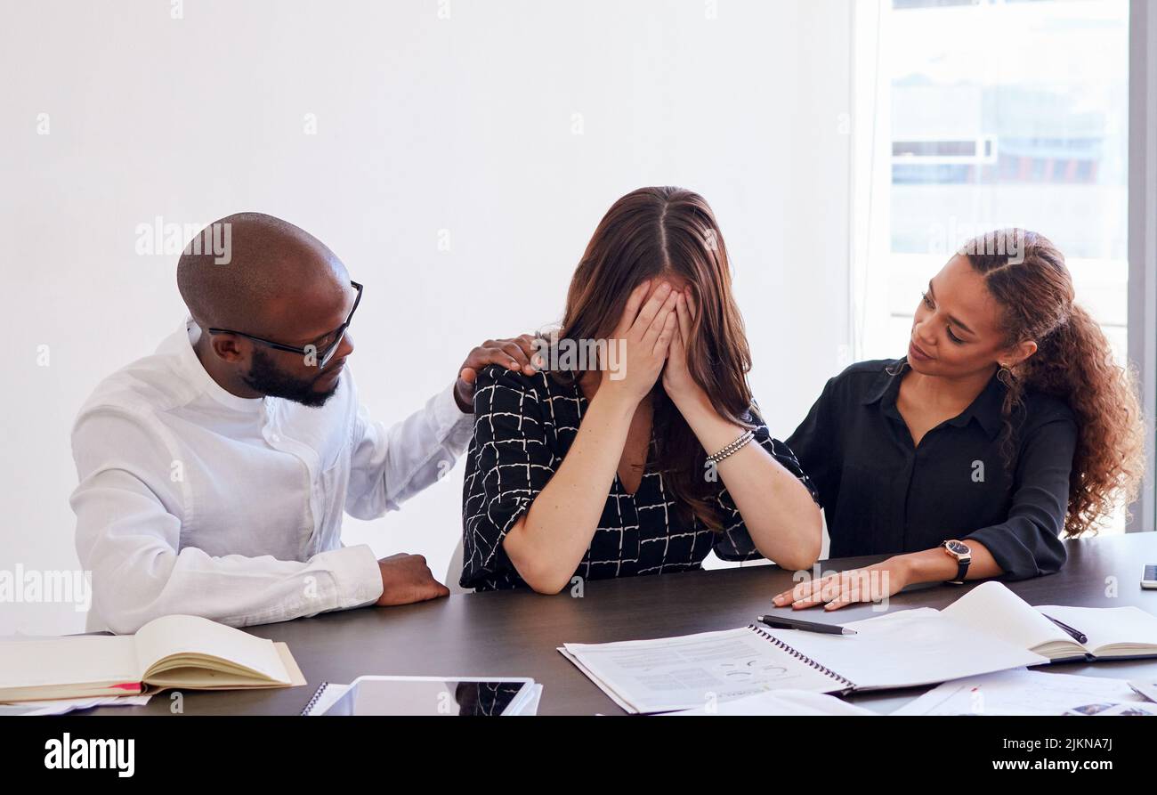 Dont worry itll be okay. a young businesswoman in distress being ...