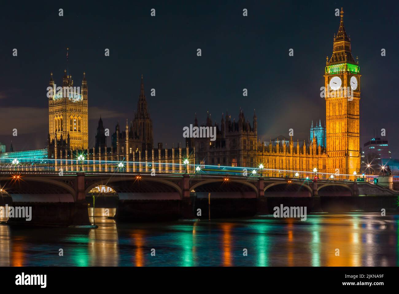 A night view of downtown London with the Tower Bridge, Big Ben and ...