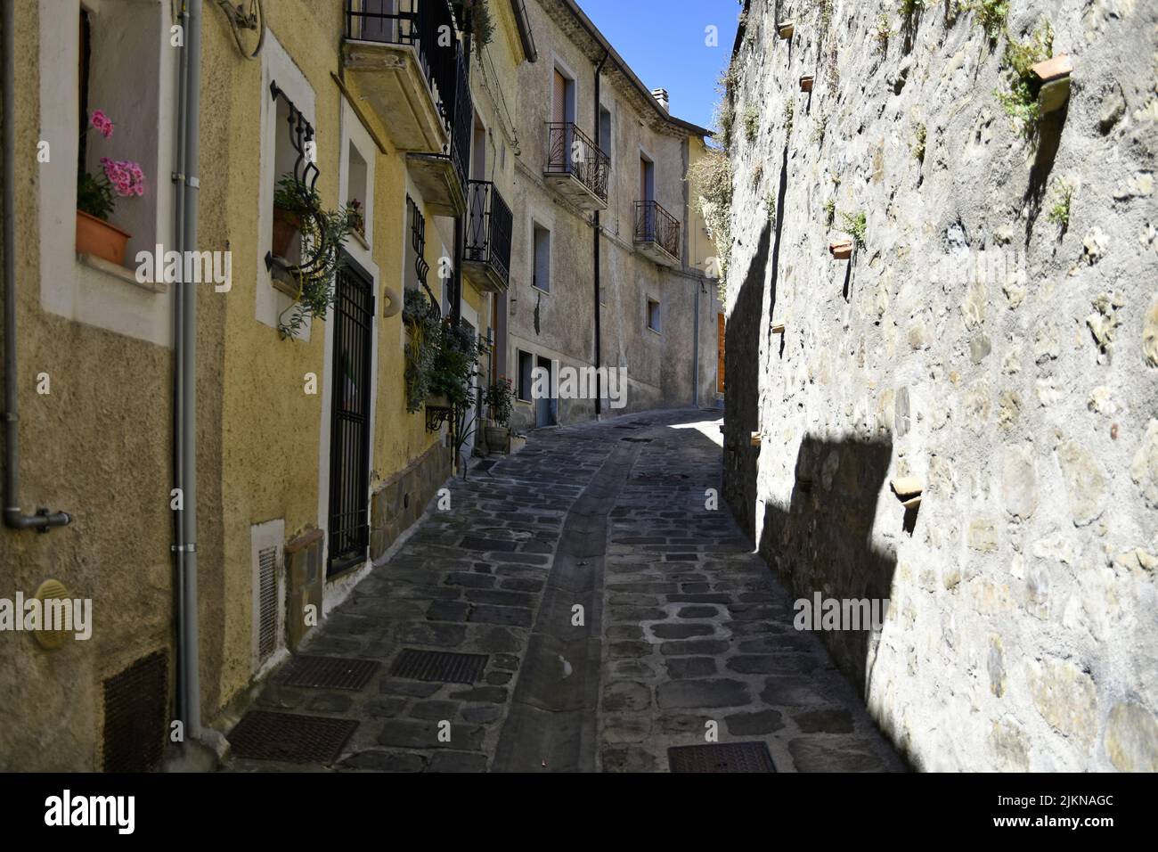 A narrow street in Calvello village in the Basilicata region of Italy ...